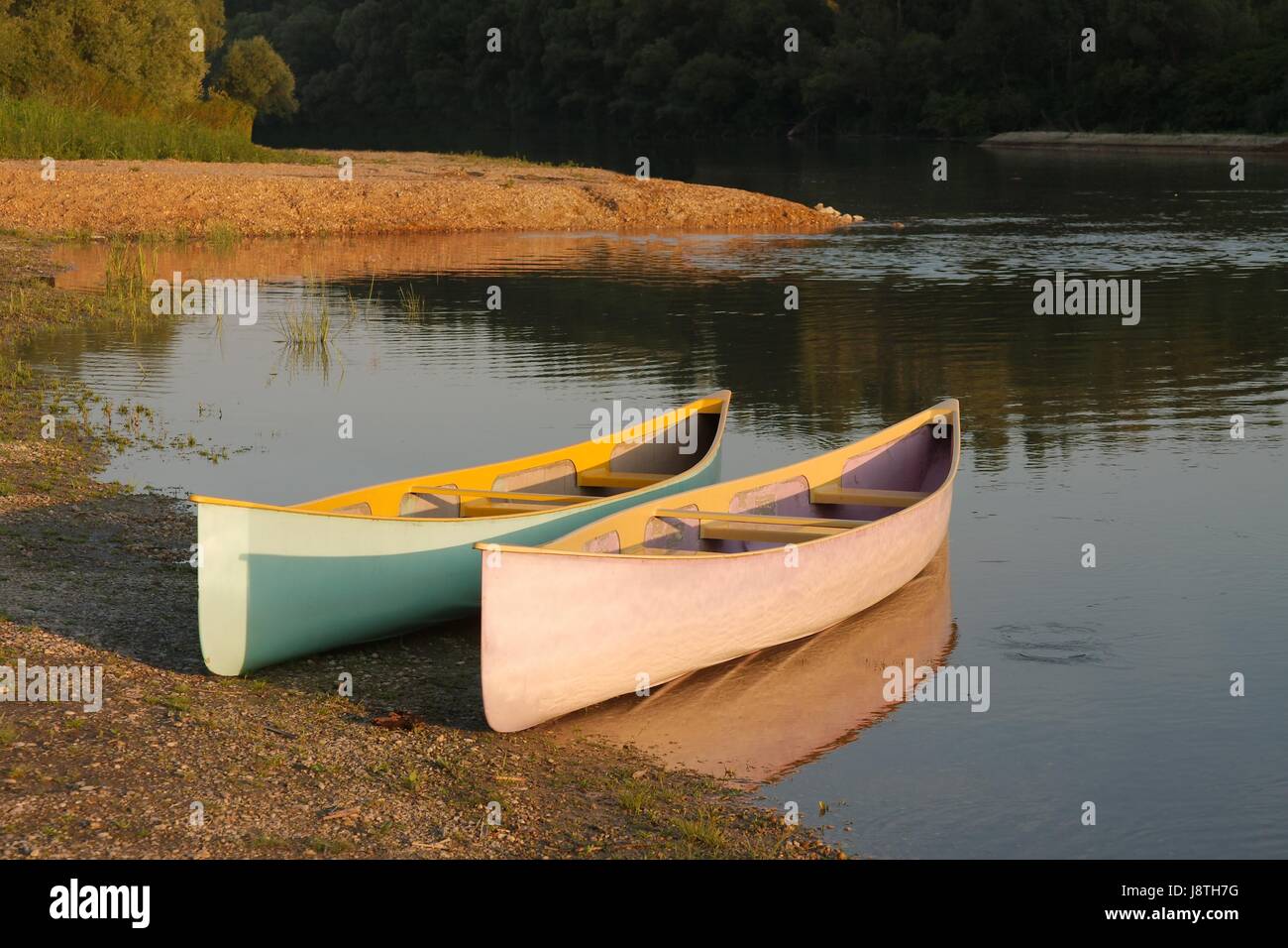 Canoes on the Riverside Stock Photo - Alamy