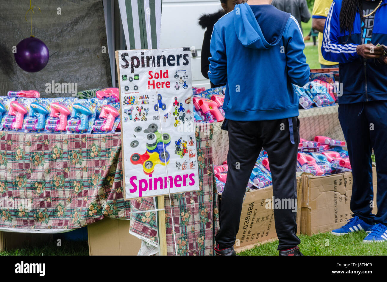 A stall selling fidget spinners and bubble guns Stock Photo - Alamy
