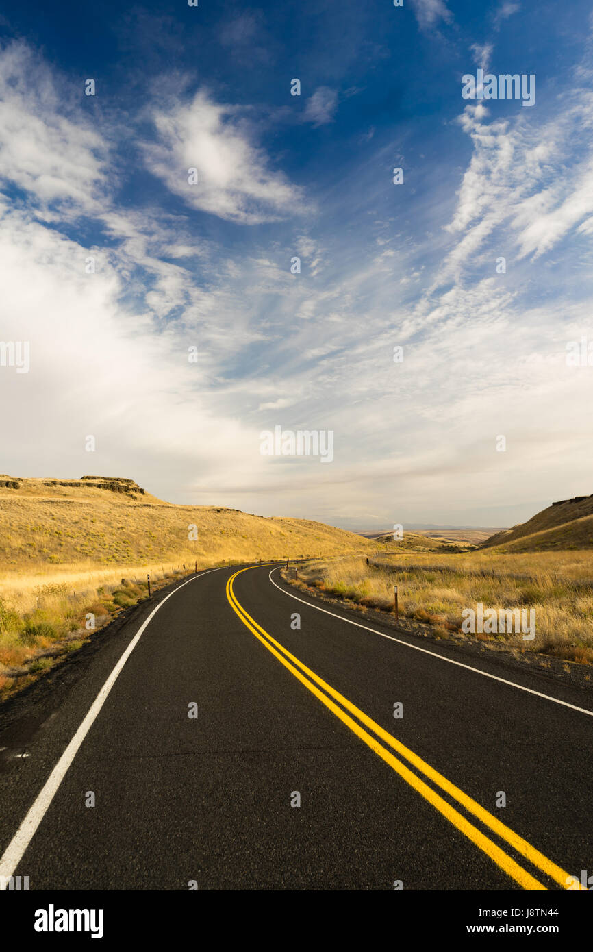 A well preserved two lane road leads around a bend to an interesting ...