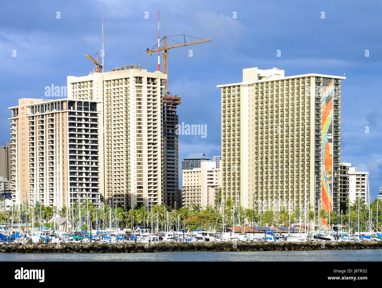 Honolulu, Hawaii, USA - May 30, 2016: High rise buildings tower behind ...
