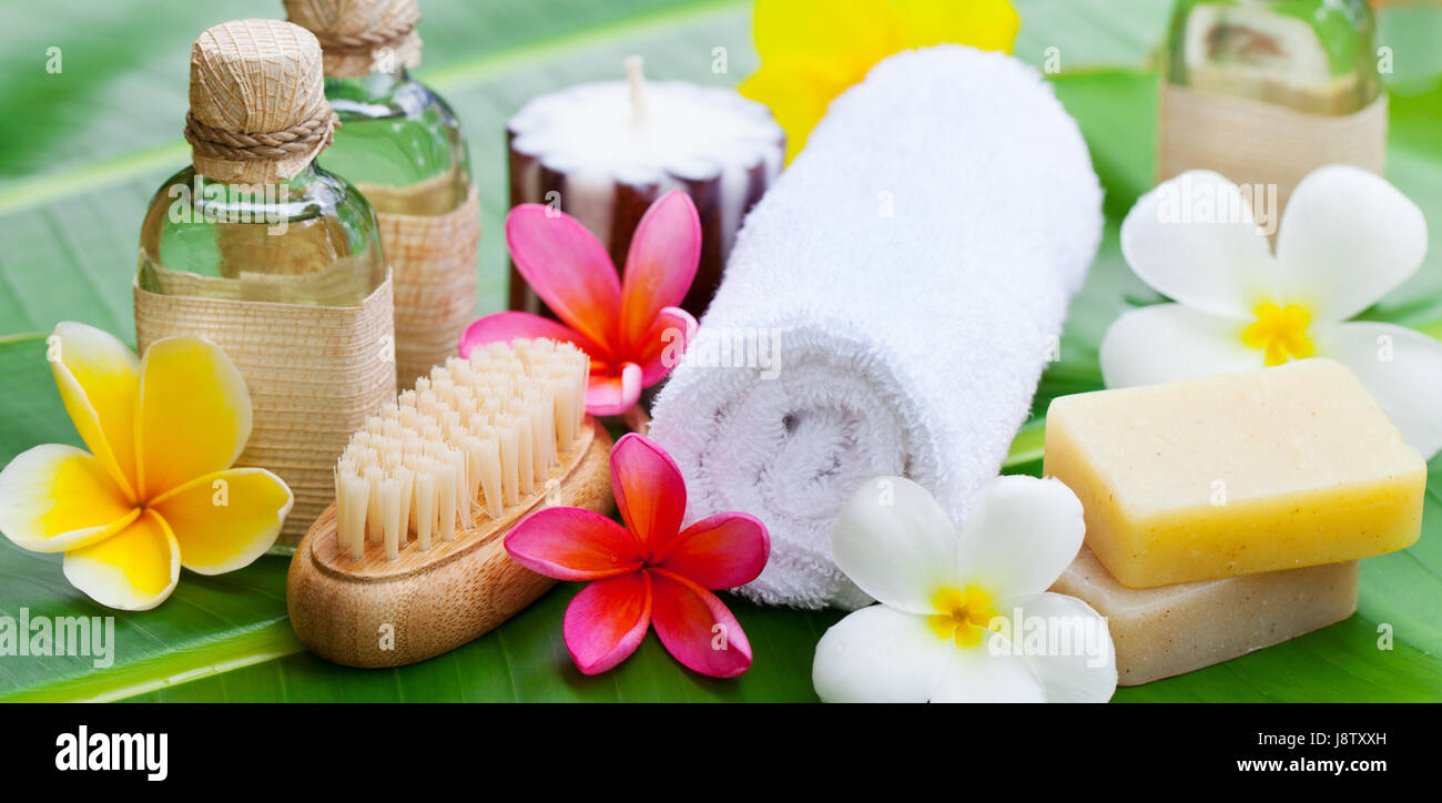 Spa, wellness setting with flowers on a palm leaf Stock Photo - Alamy