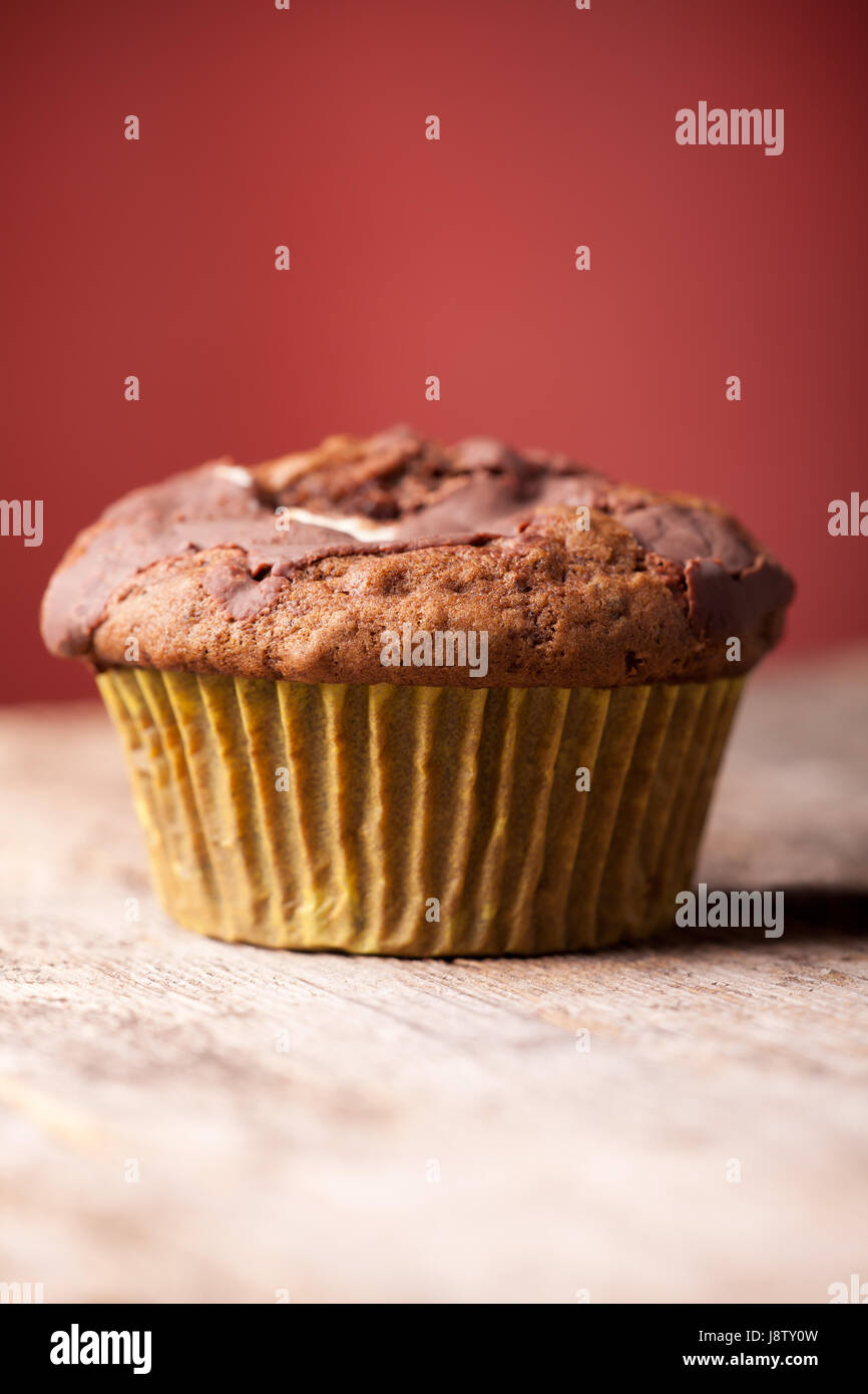 single muffin on red background Stock Photo - Alamy