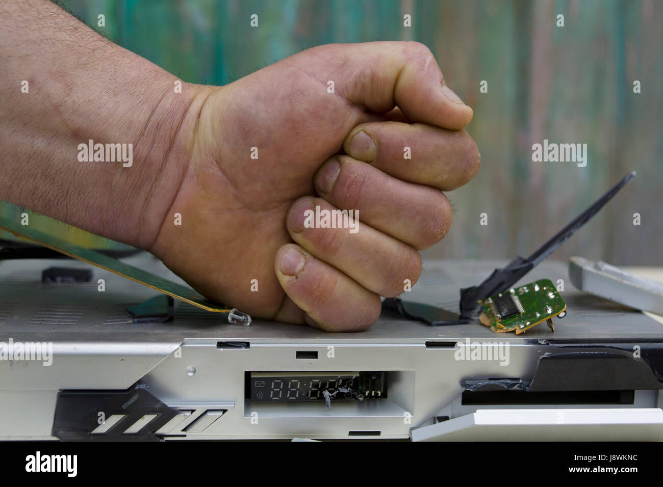 Hand smashing hi-res stock photography and images - Alamy