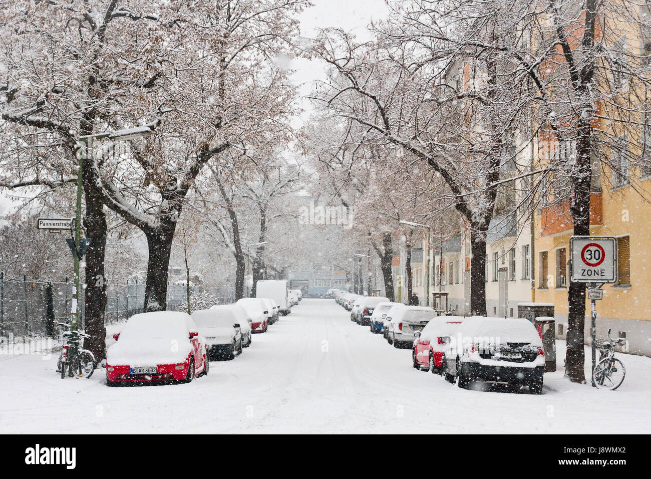 Snow-covered parked cars after a heavy snowfall during winter in Berlin ...