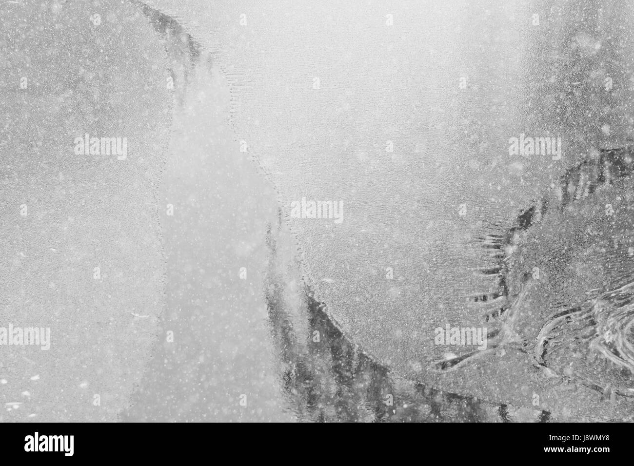 Ice forming on the canal after a heavy snowfall during winter in Berlin ...