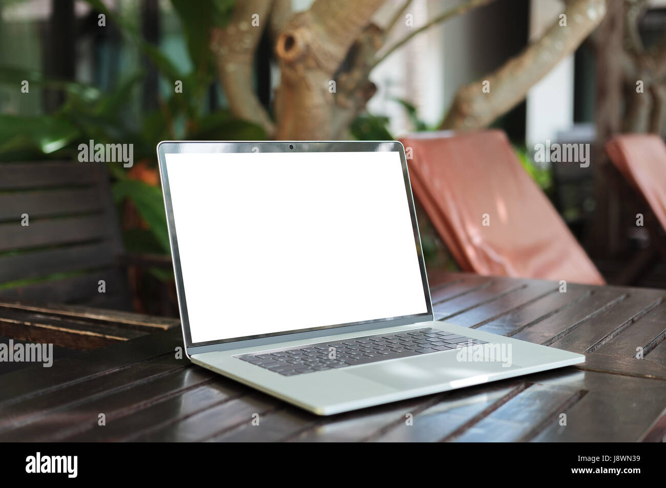 laptop computer white screen on table resort view background Stock ...