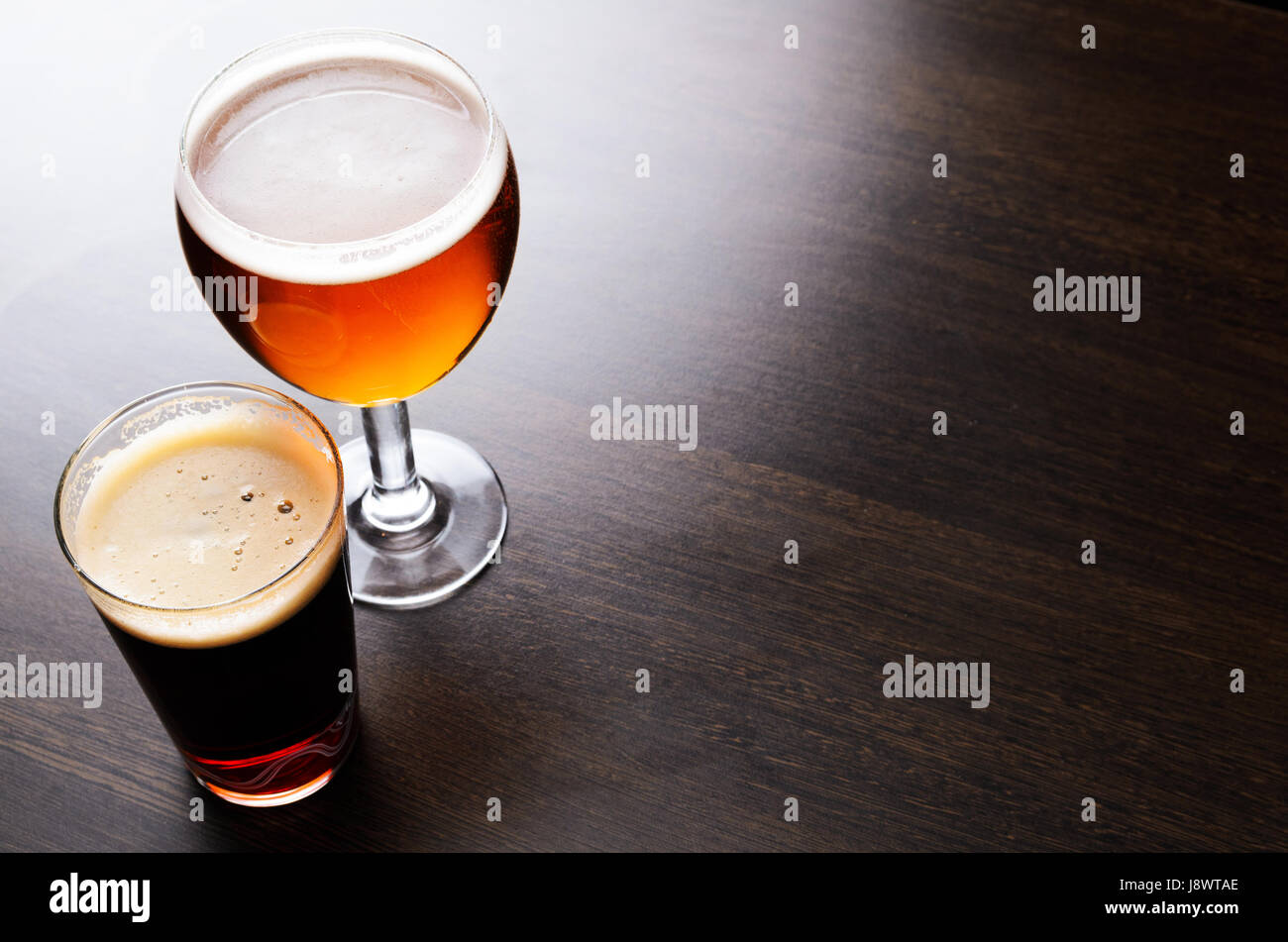 Glass of fresh beer on pub counter Stock Photo - Alamy