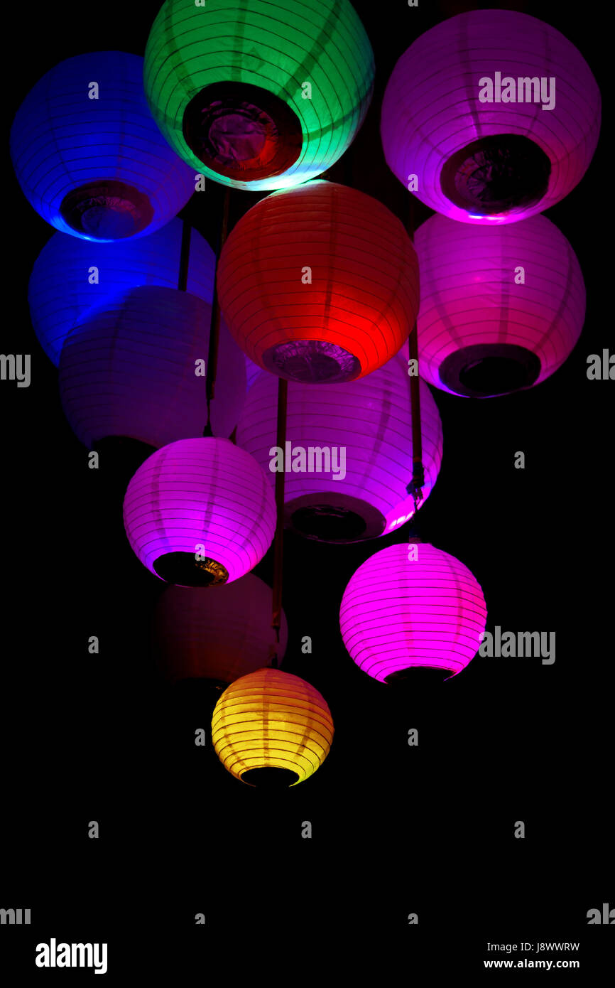 Group of colored paper lanterns glowing in the dark Stock Photo - Alamy