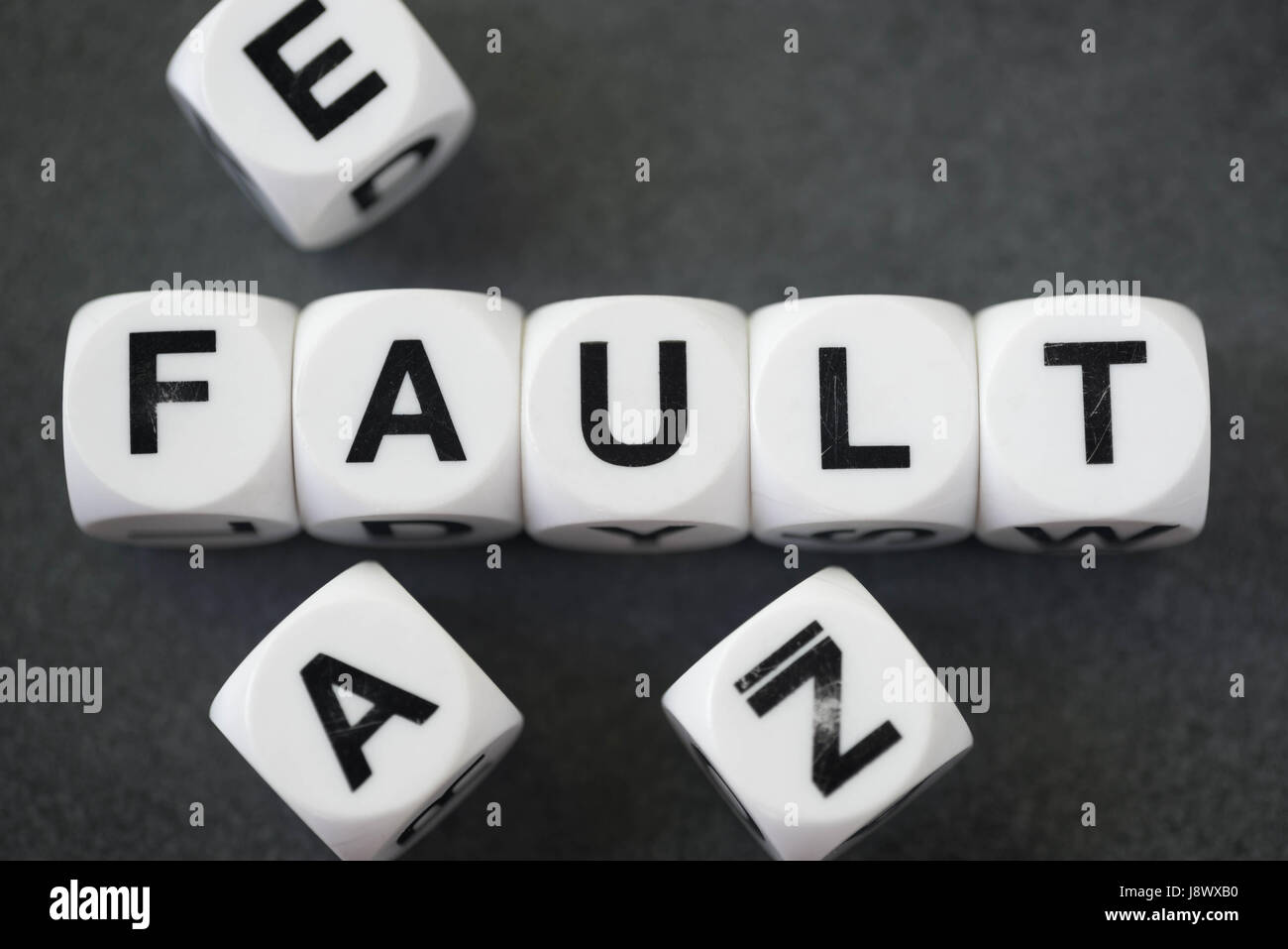 word fault on white toy cubes Stock Photo - Alamy