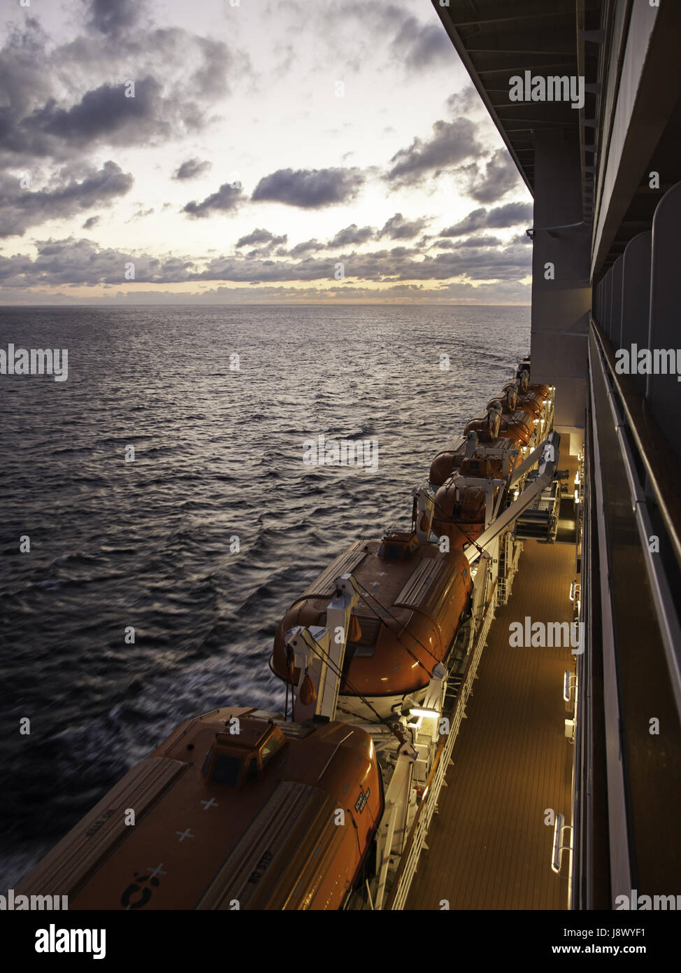 Night cruise, detail of a side of a luxury boat, maritime transport ...