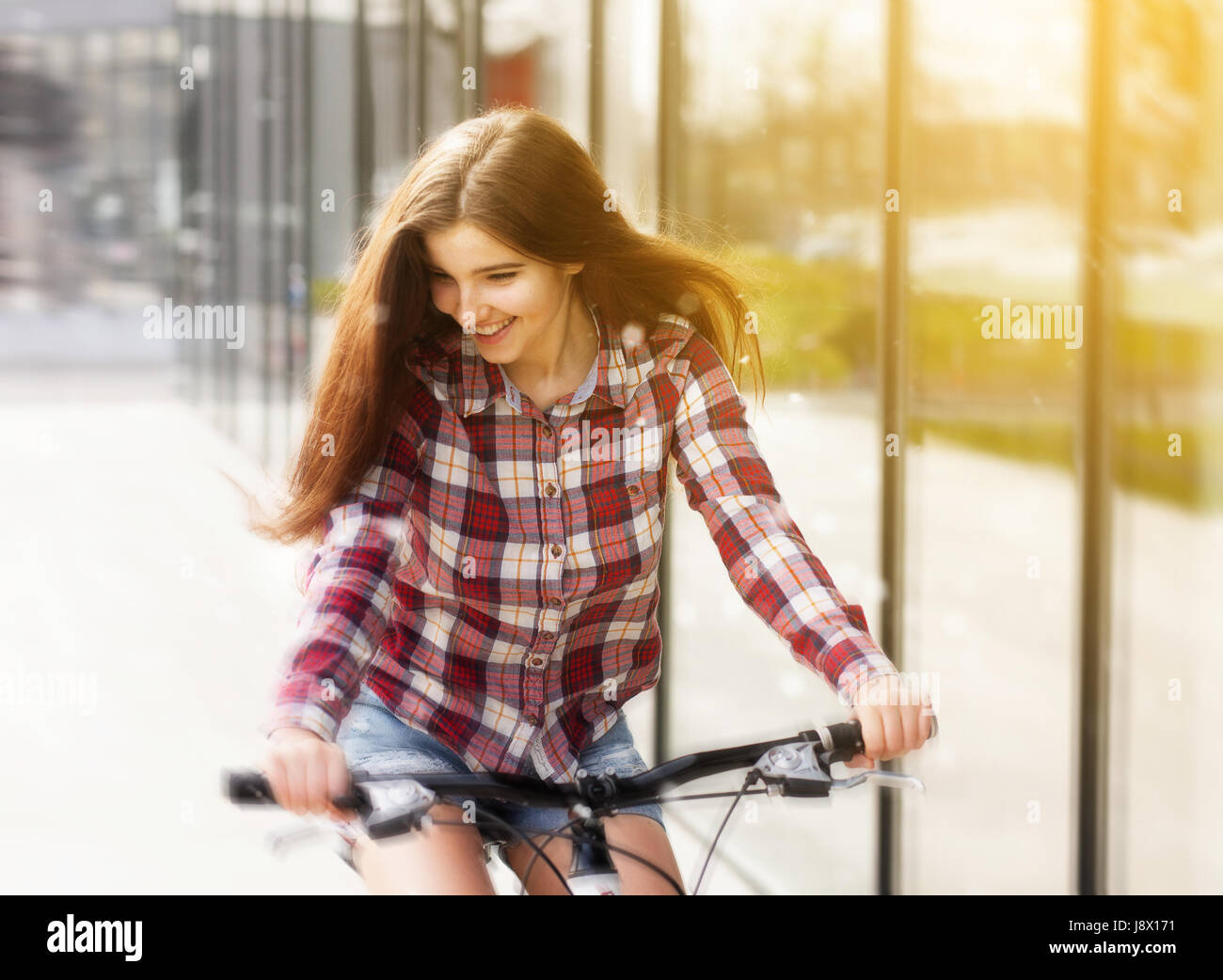 Beautiful woman cycling hi-res stock photography and images - Alamy