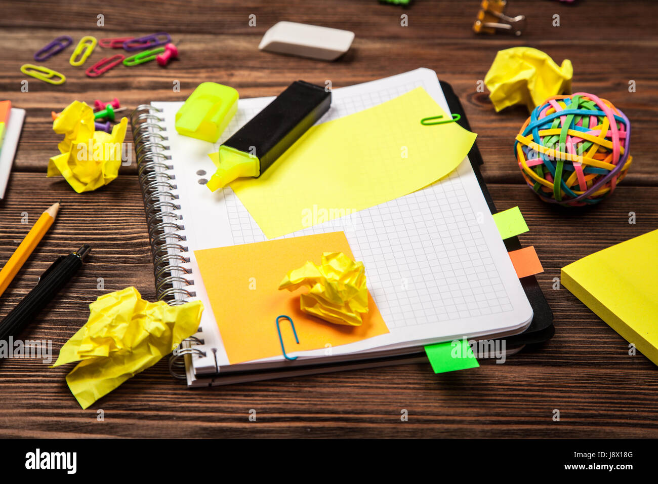 Open notepad with office supplies Stock Photo - Alamy