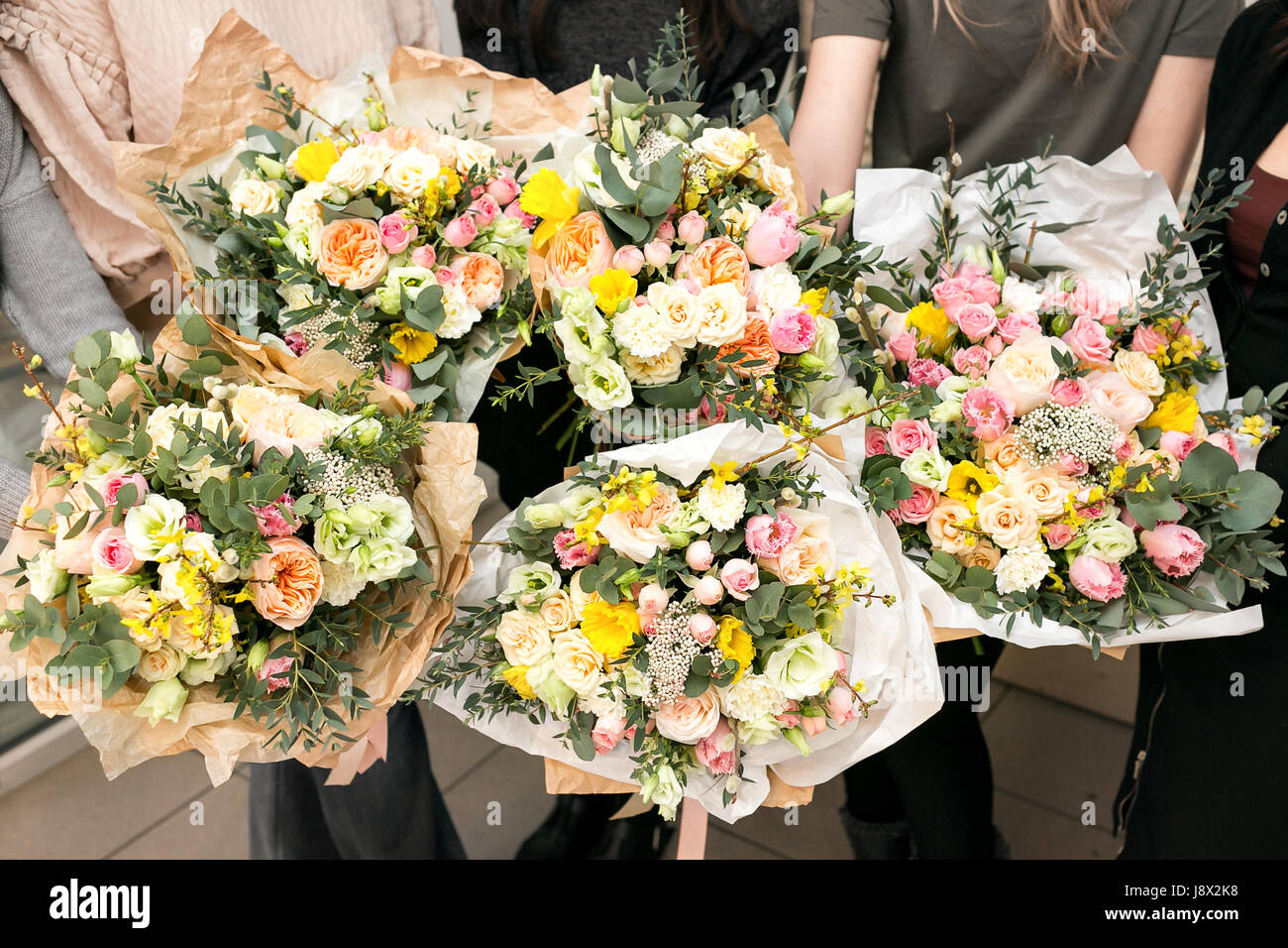 Workshop florist, making bouquets and flower arrangements. Woman ...