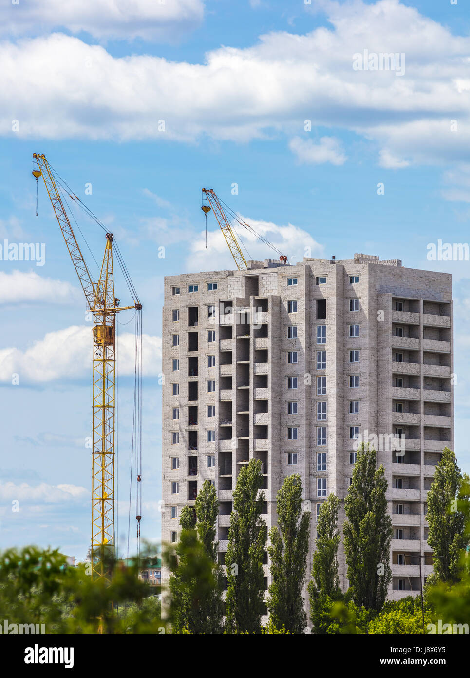 Industrial landscape, construction of high-rise buildings and cranes ...