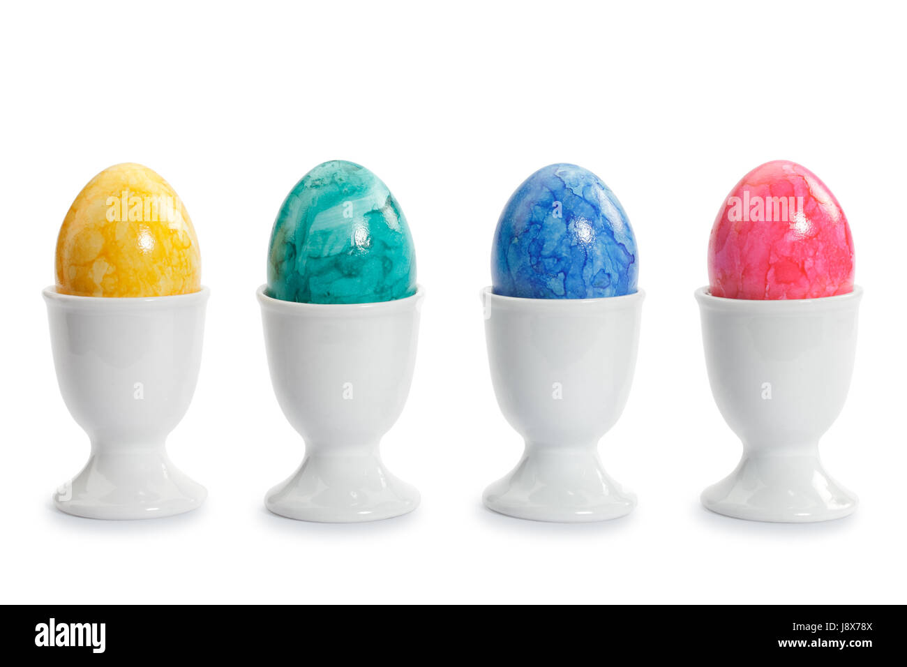 easter eggs in egg cups Stock Photo - Alamy