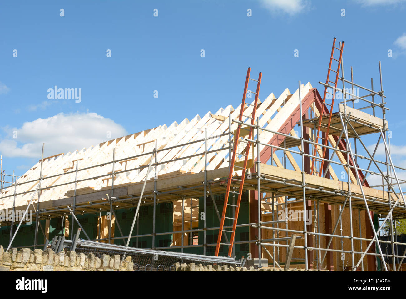 House being built with scaffolding hi-res stock photography and images ...