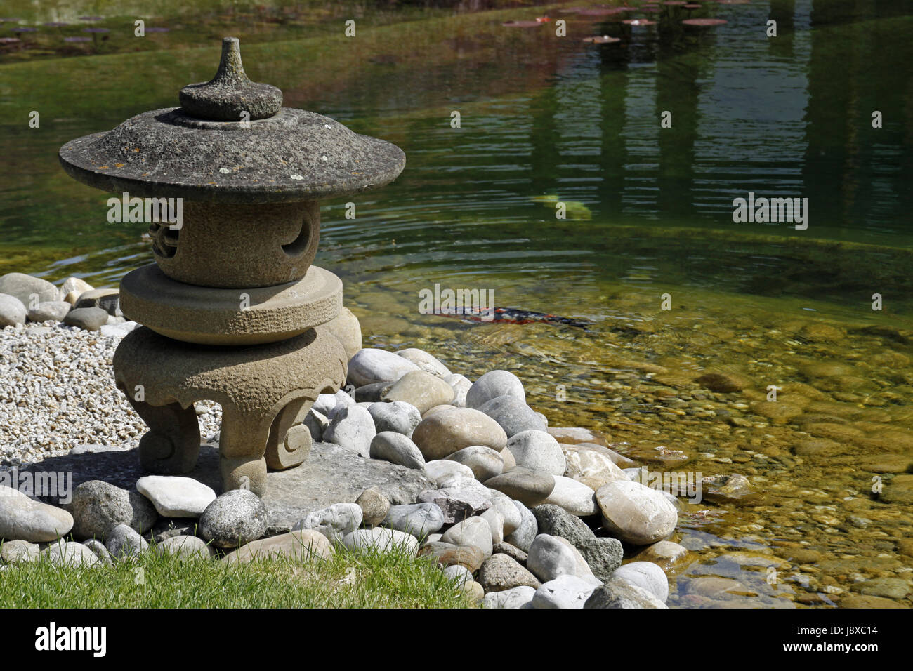 stone lantern in a japanese garden Stock Photo - Alamy