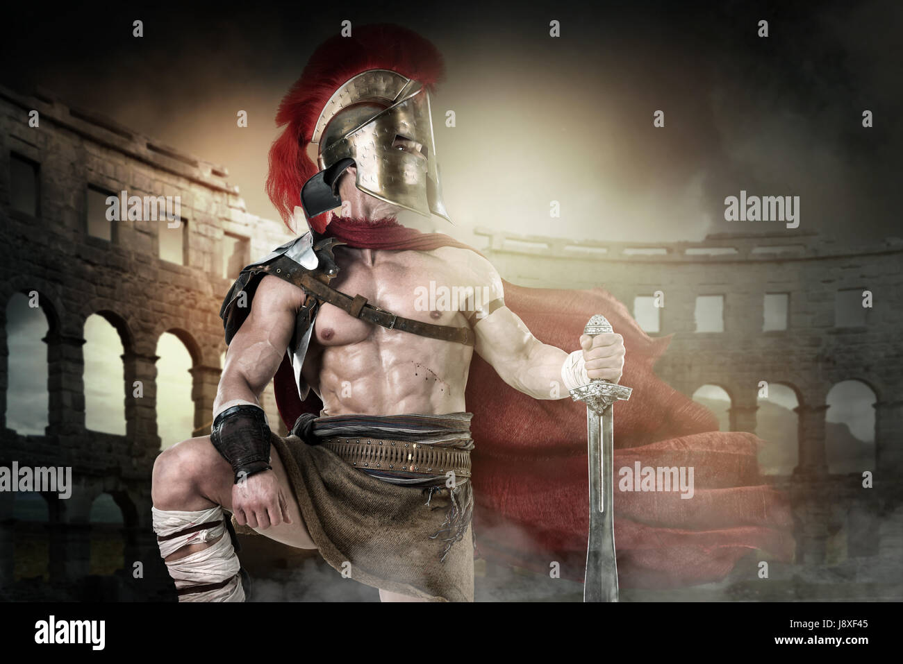 Ancient warrior or Gladiator posing in the arena Stock Photo - Alamy