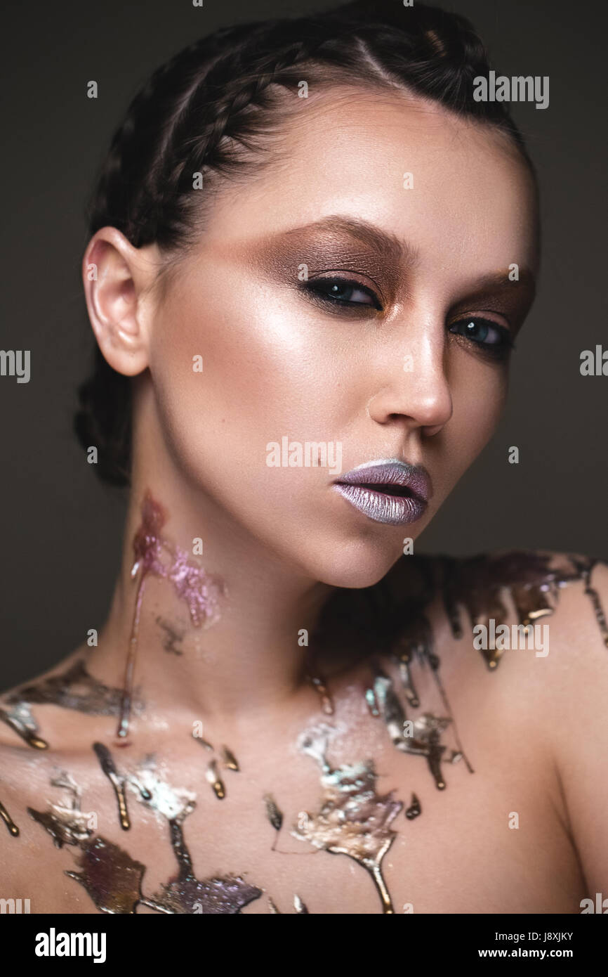 Beautiful strange girl with creative art make-up. Beauty face Stock ...