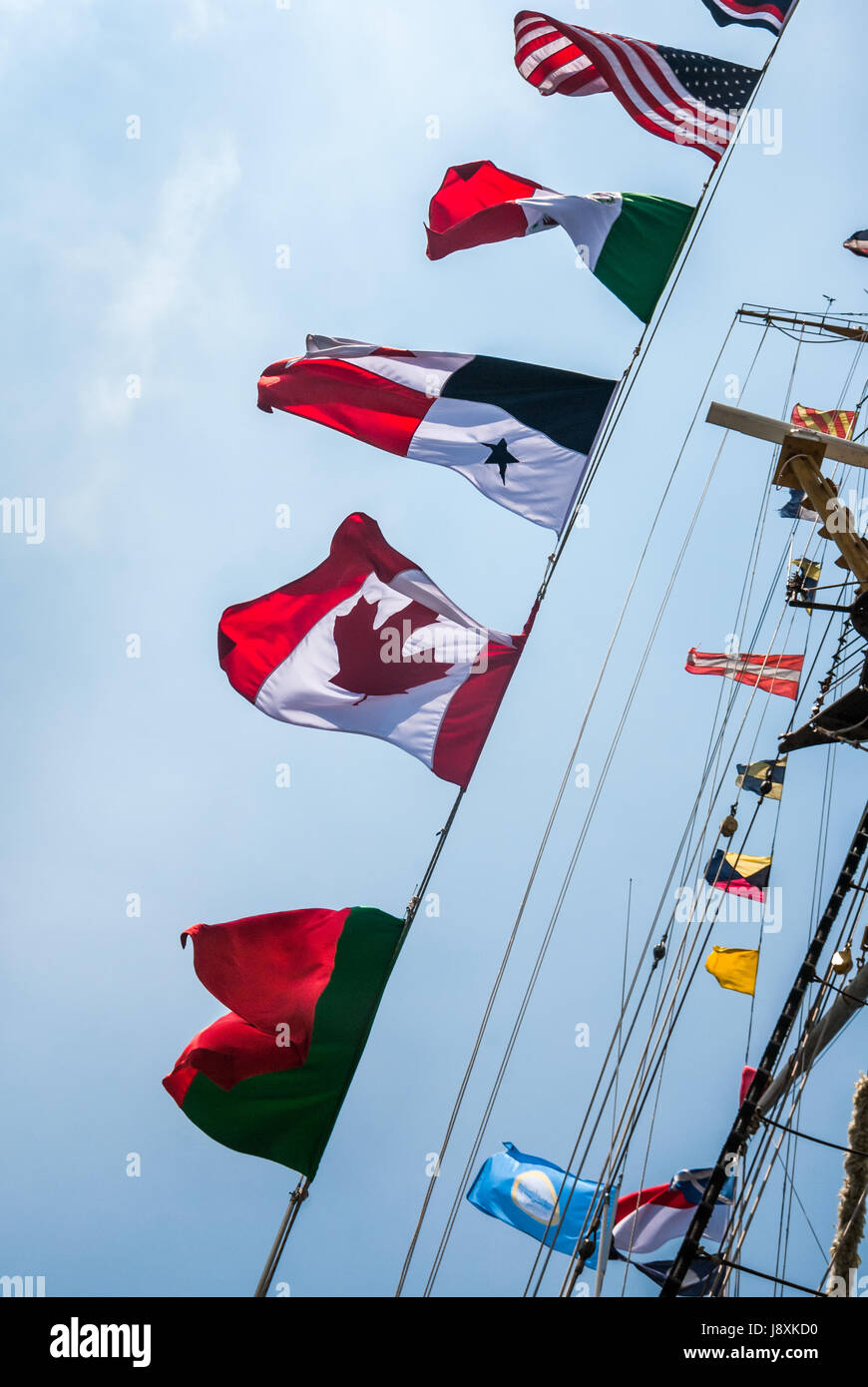 National flags of various countries on Indonesian KRI Dewaruci tall ...
