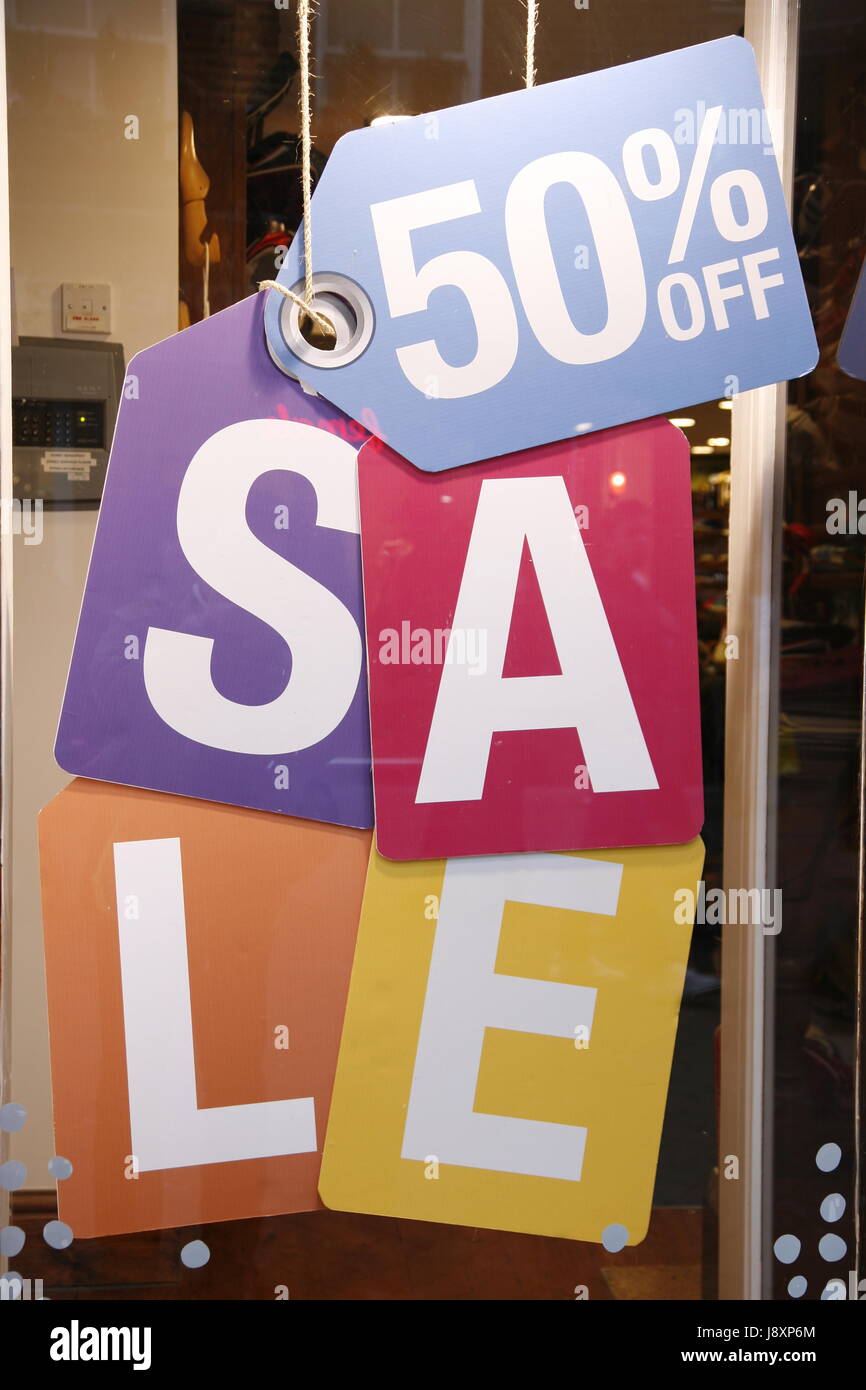 Sale signs in shop window, big reductions Stock Photo - Alamy