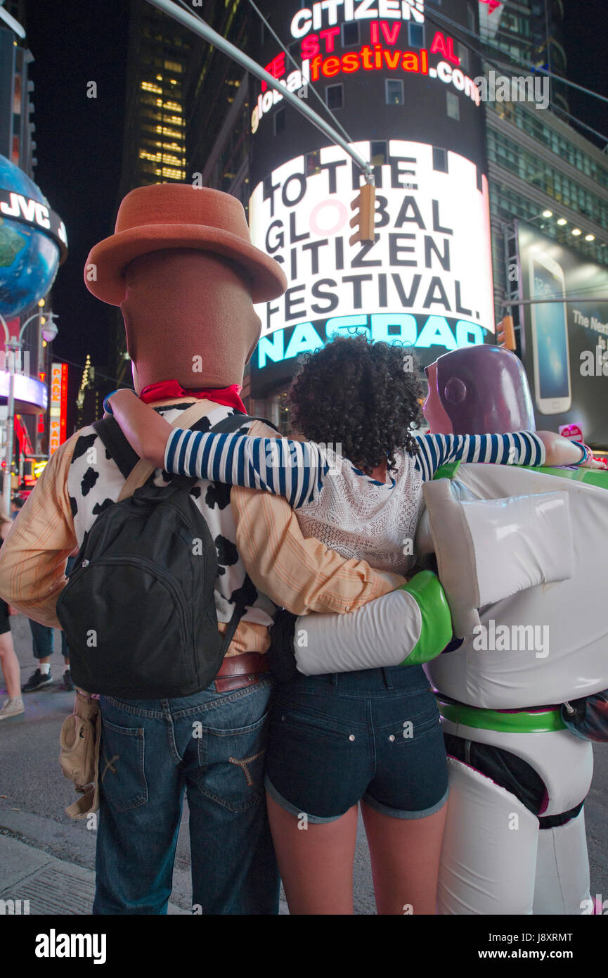 Tourist poses for a photo with Toy Story characters impersonators on ...