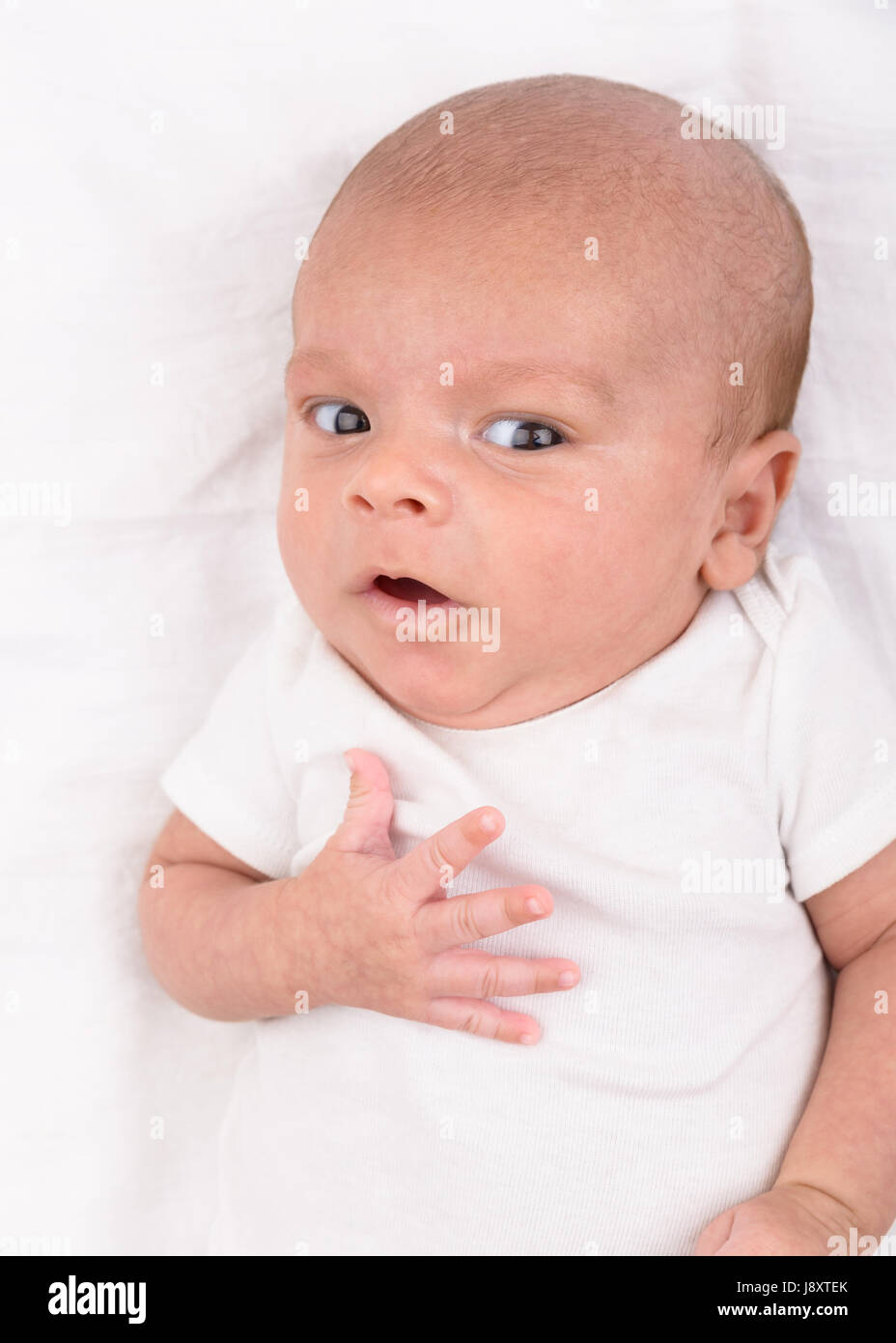 Mixed race south asian and caucasian newborn baby on white sheet Stock ...