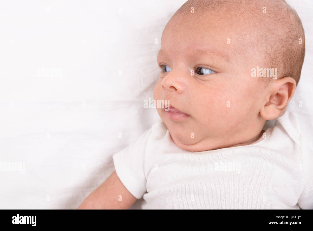 Mixed race south asian and caucasian newborn baby on white sheet Stock ...
