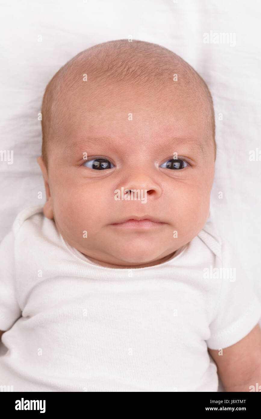 Mixed race south asian and caucasian newborn baby on white sheet Stock ...