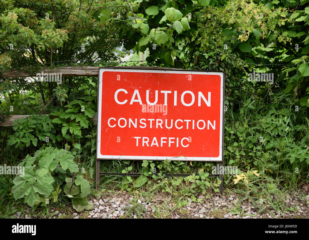 Caution sign on country lane Stock Photo - Alamy