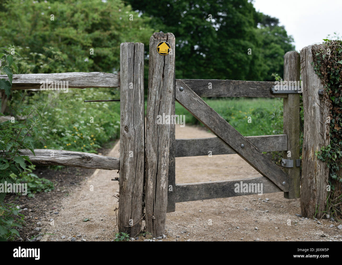 Old and worn wooden gate on footpath in countryside in cheshire uk ...