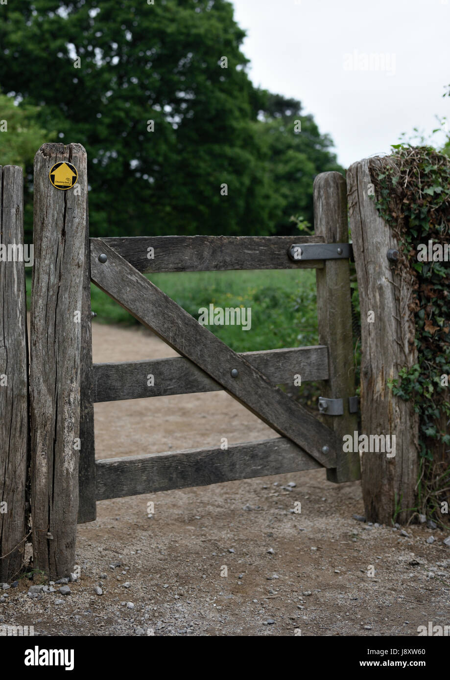 Old and worn wooden gate on footpath in countryside in cheshire uk ...