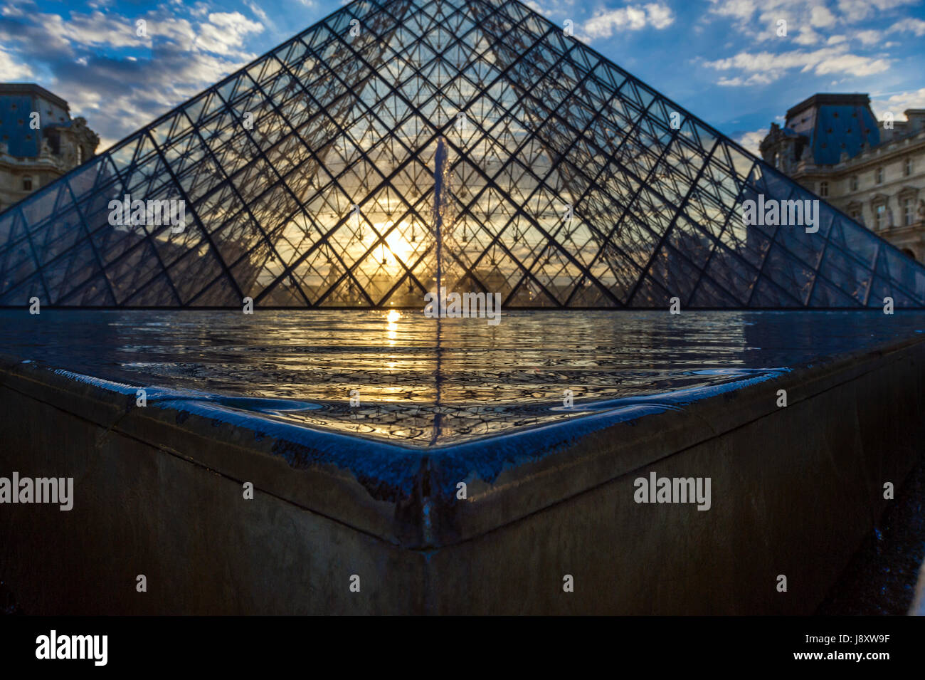 Louvre Pyramid at sunset Stock Photo - Alamy
