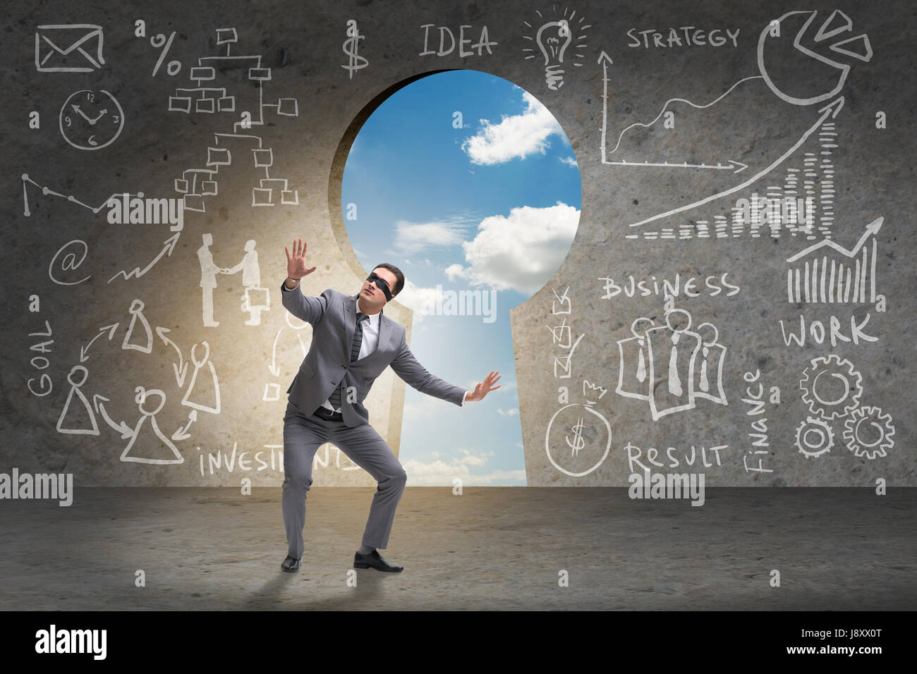 Businessman lost in front of giant keyhole Stock Photo - Alamy