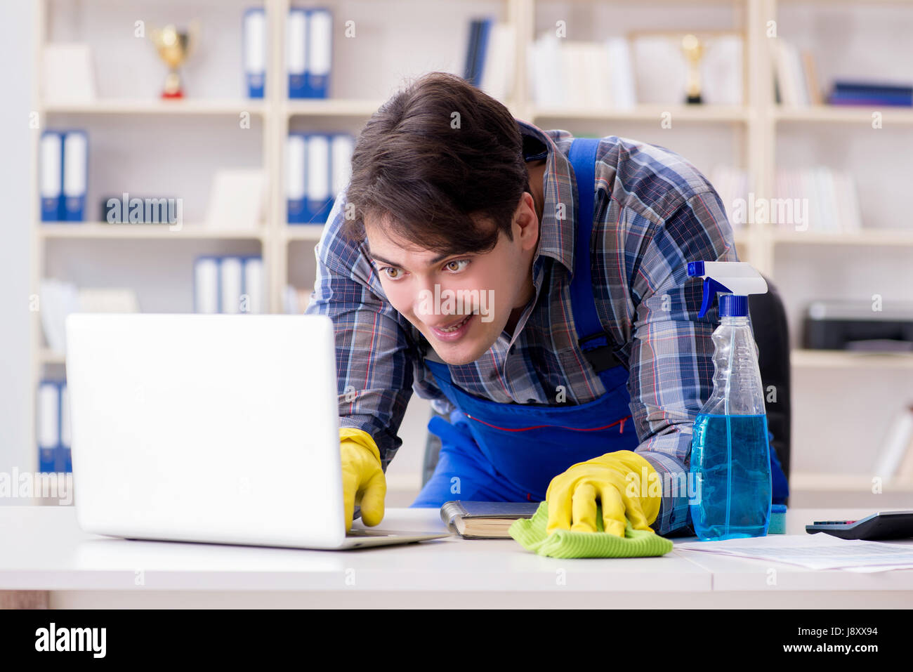 Hacker under cleaner cover stealing personal data Stock Photo - Alamy