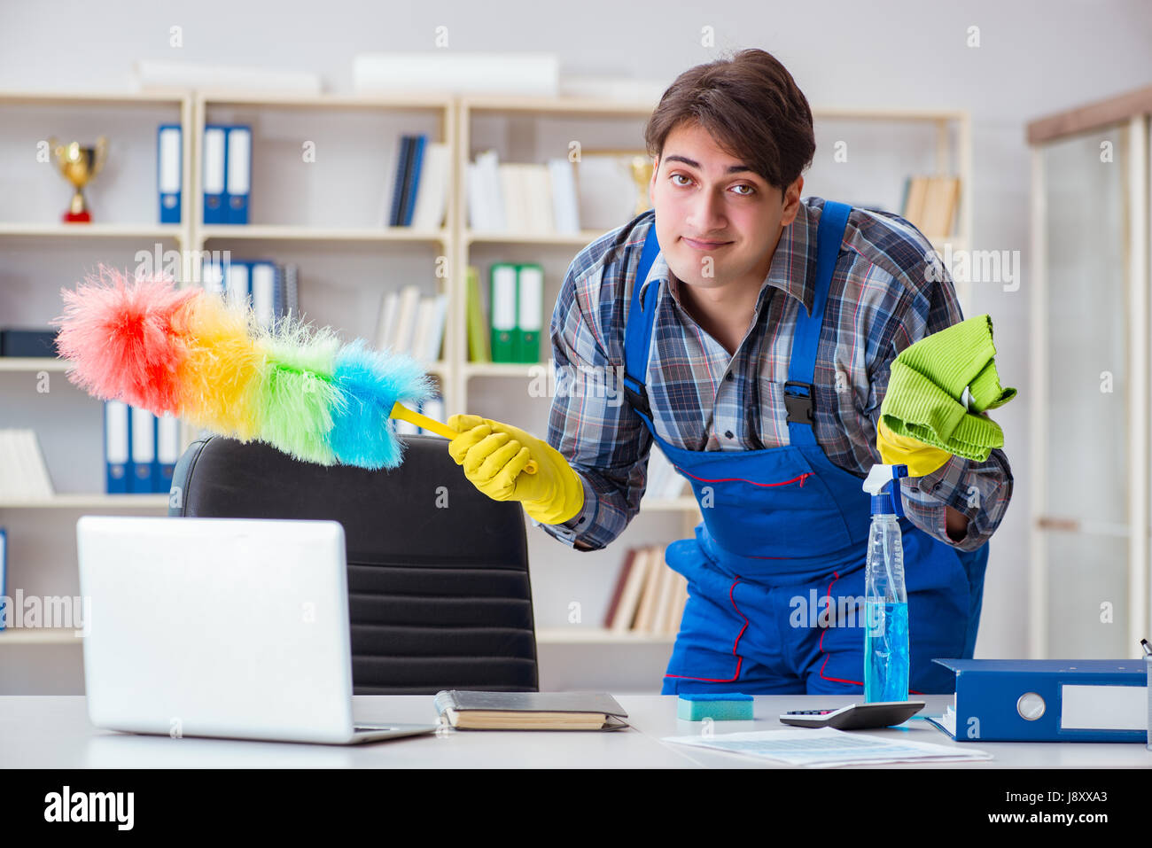 Male cleaner working in the office Stock Photo - Alamy