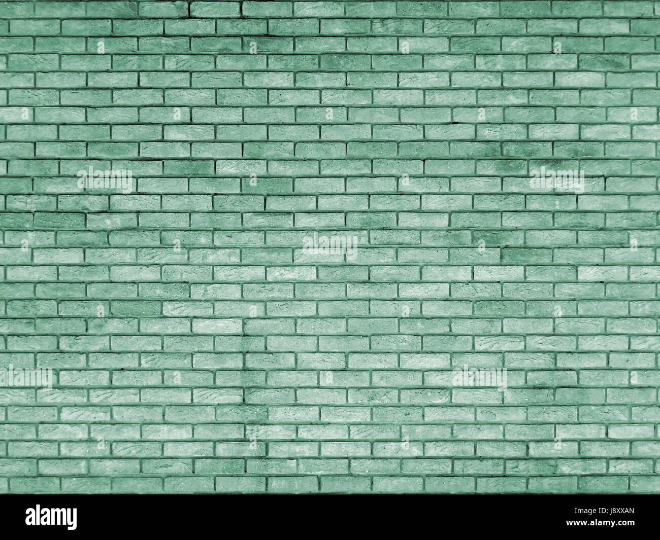 green toned brick wall with repeating pattern Stock Photo - Alamy