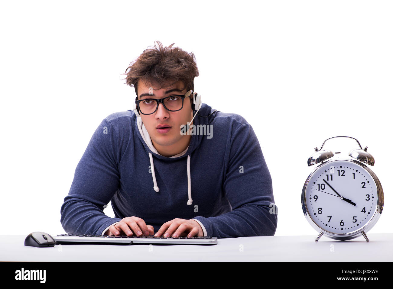 Funny nerd call center operator with giant clock Stock Photo - Alamy