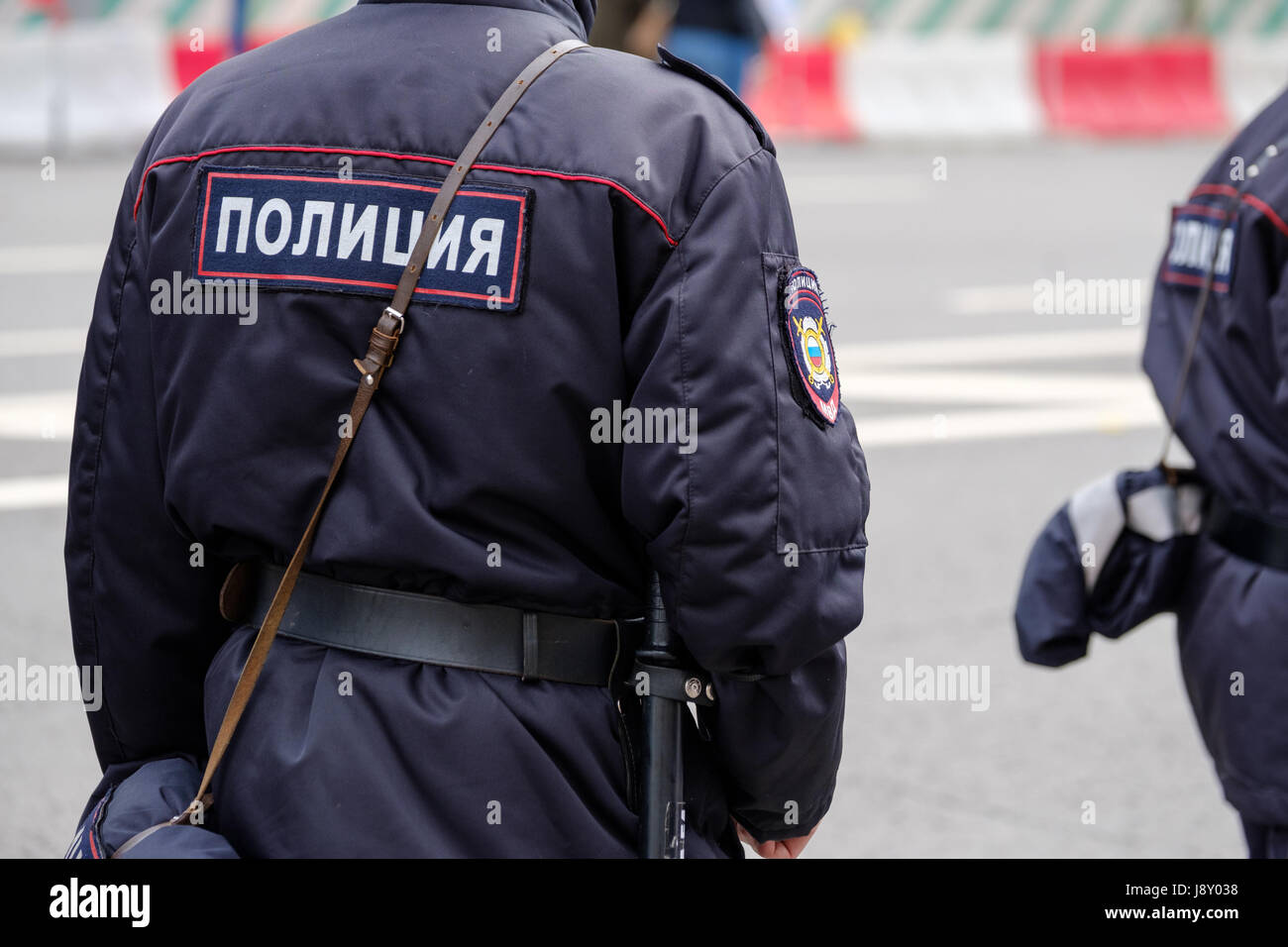 Policeman in uniform, rear view Stock Photo - Alamy