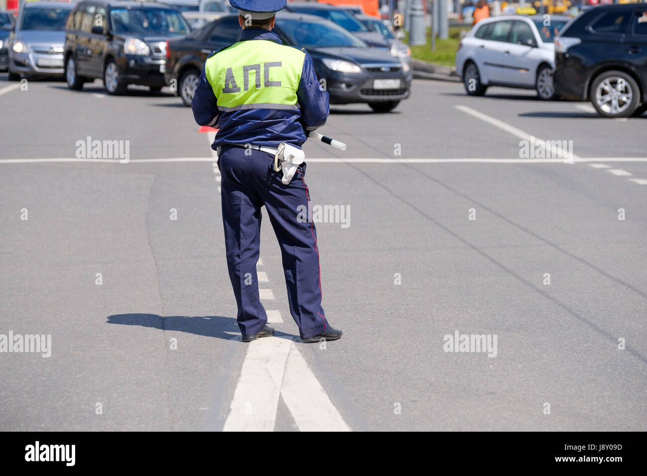 Traffic policeman works on the street at day time Stock Photo - Alamy