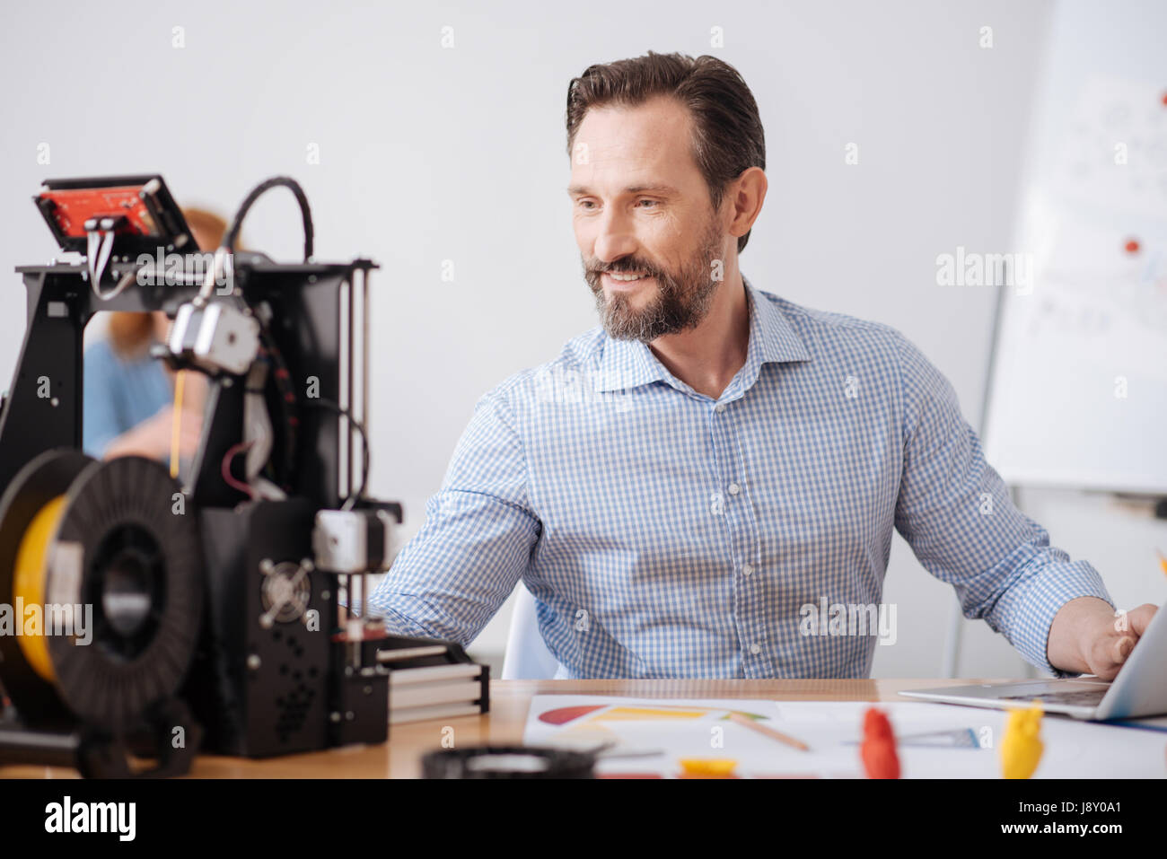 Cheerful positive man working on the computer Stock Photo - Alamy