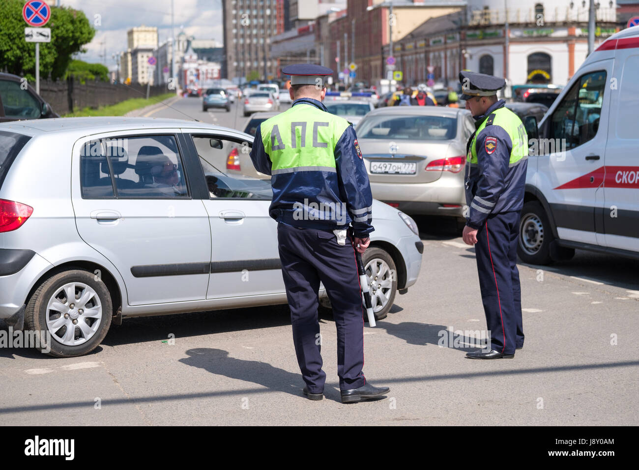 Traffic policeman works on the street at day time Stock Photo - Alamy