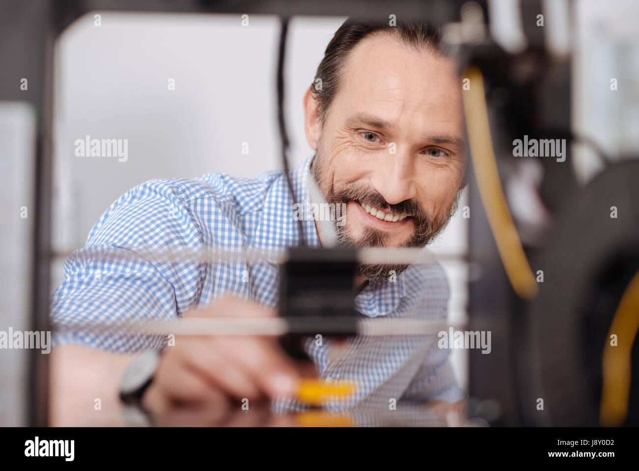 Happy positive man working with 3d technology Stock Photo - Alamy