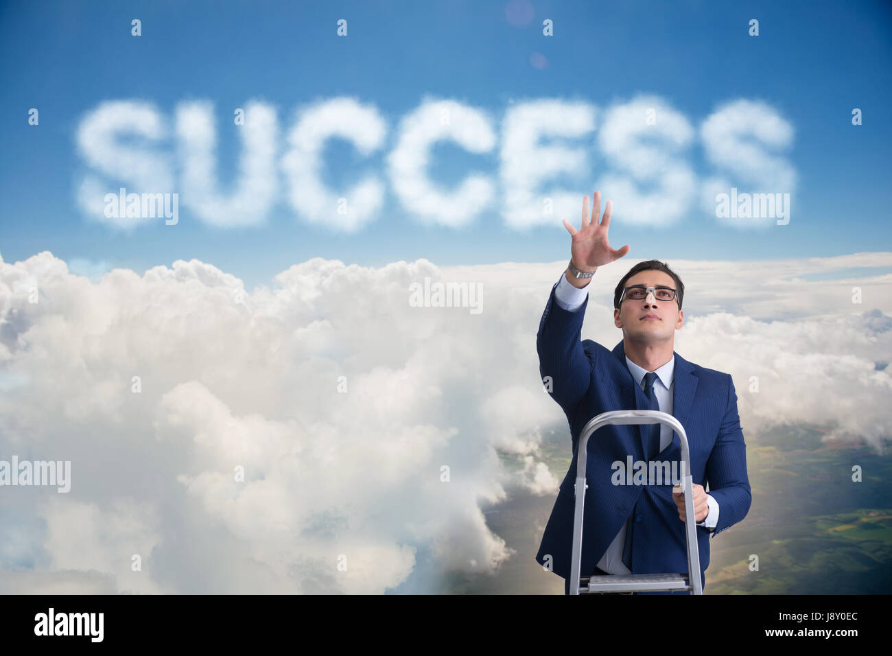 Businessman reaching success with career ladder Stock Photo - Alamy