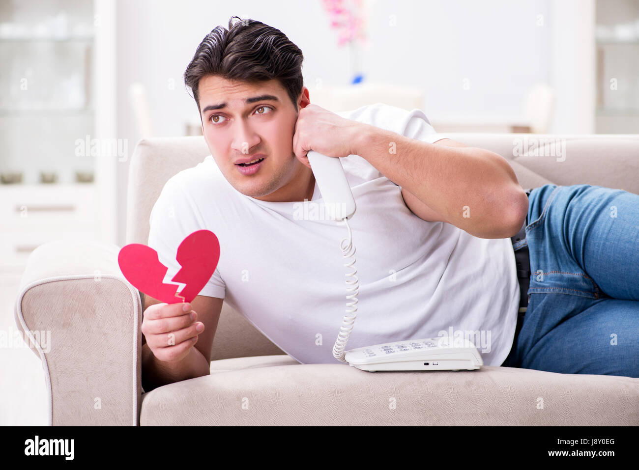 Young man in sad saint valentine concept Stock Photo - Alamy