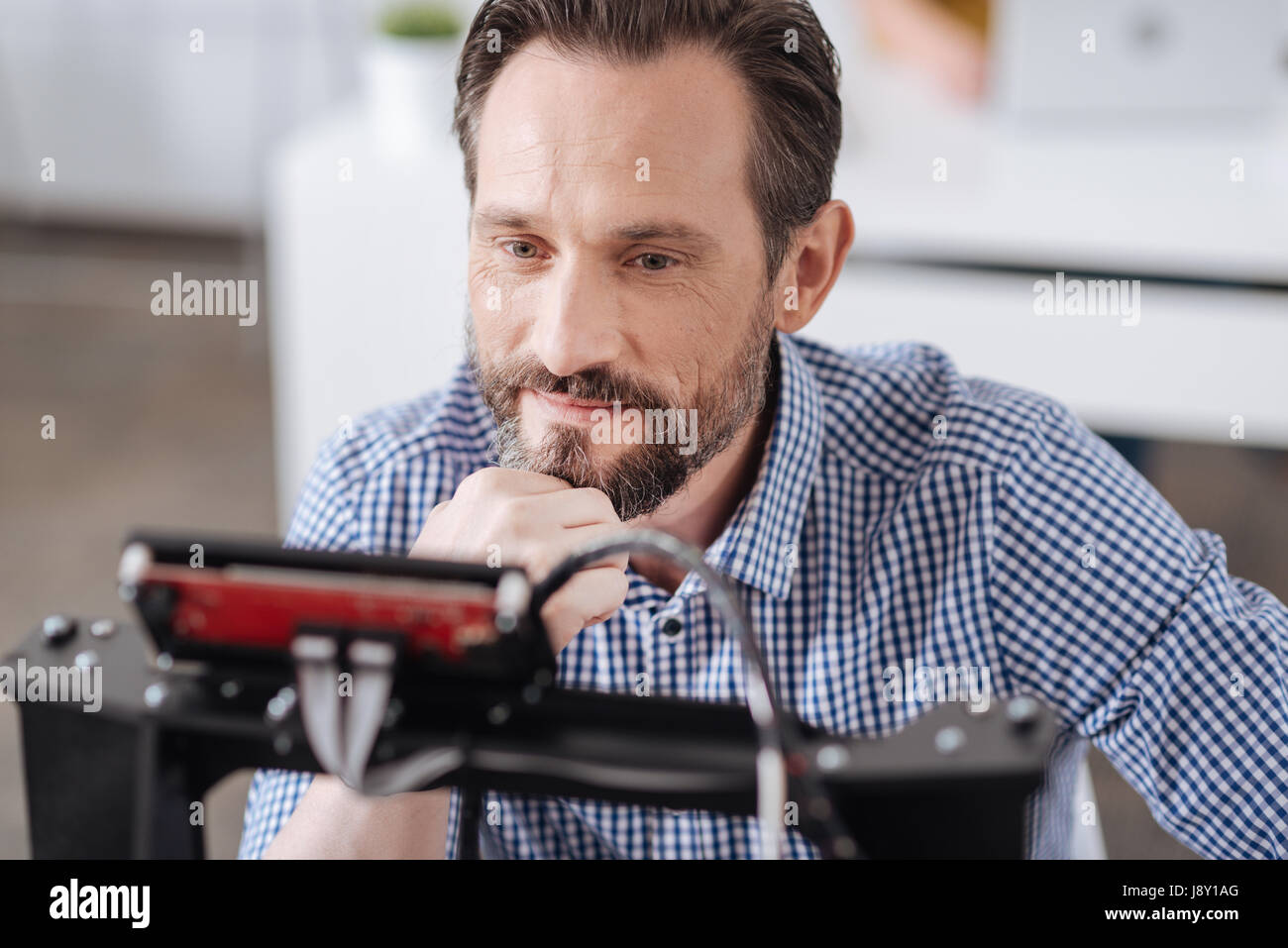 Good looking nice designer thinking about his project Stock Photo - Alamy