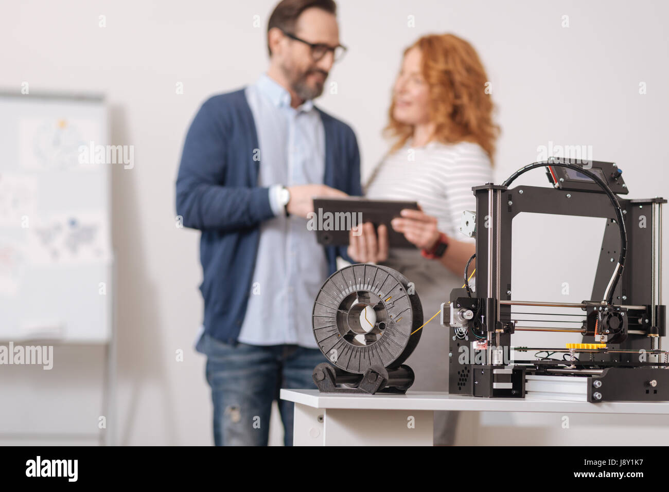 Selective focus of a filament being connected to the 3d printer Stock ...