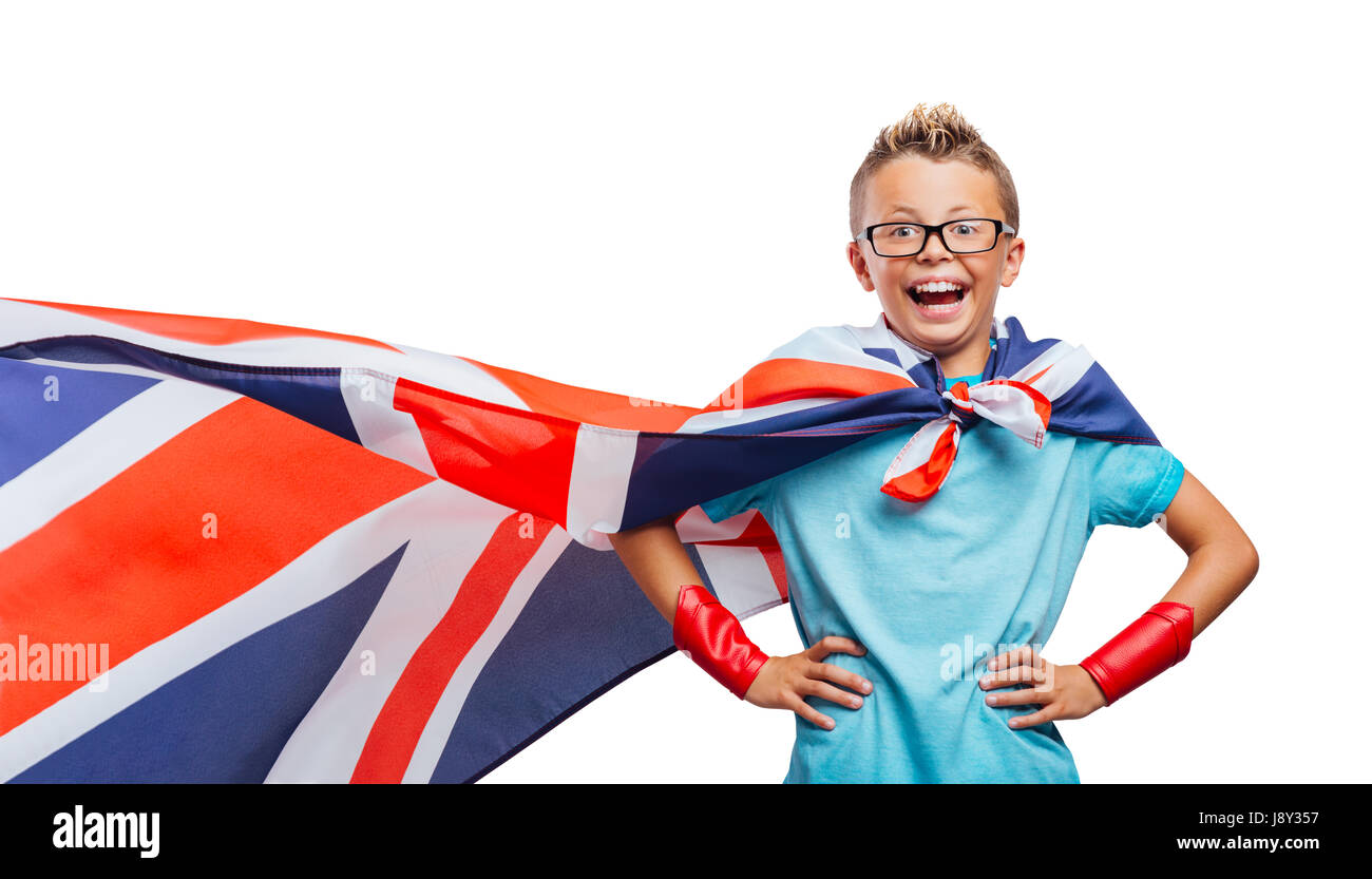 Cute smiling superhero boy posing with arms akimbo and wearing a ...