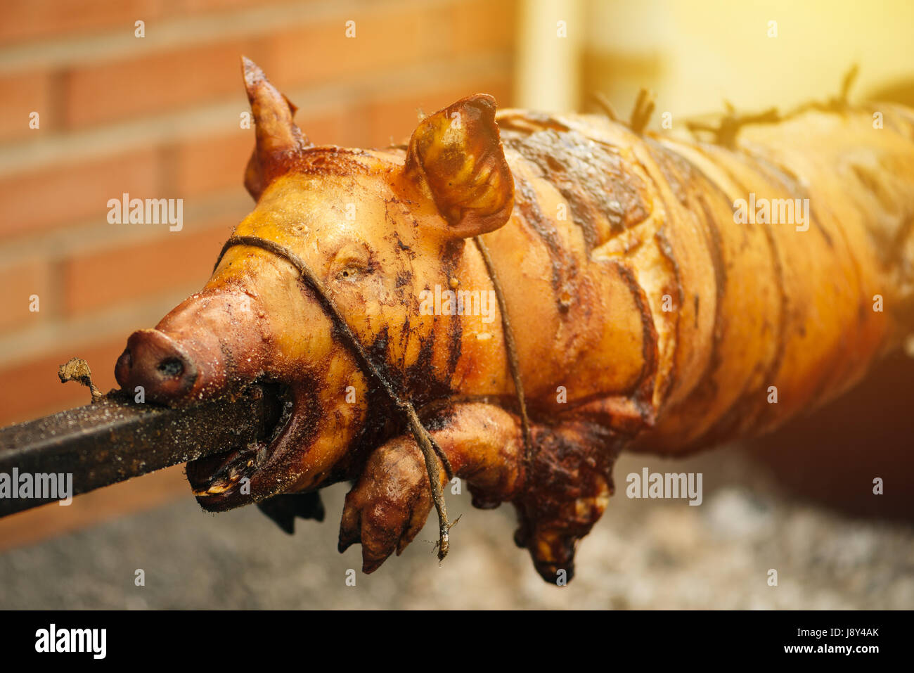 Roasted on a spit hi-res stock photography and images - Alamy