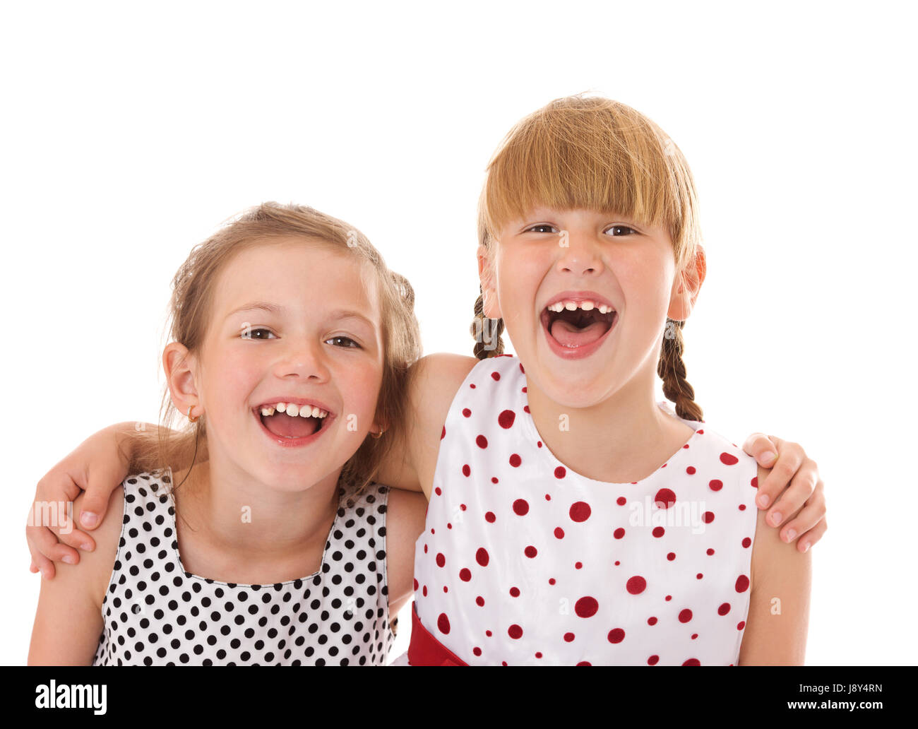 Two happy little sisters portrait isolated on white Stock Photo - Alamy